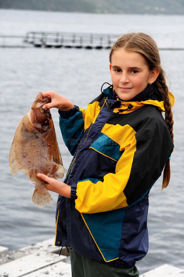 A Little Girl in Norway Has a Big Fish in Hand Stock Image - Image of ...