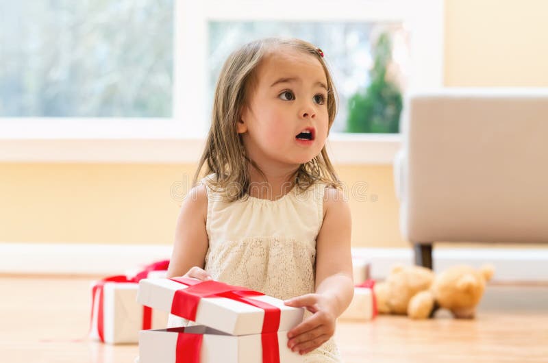 Little Girl Opening a Christmas Present Stock Photo - Image of cheerful ...