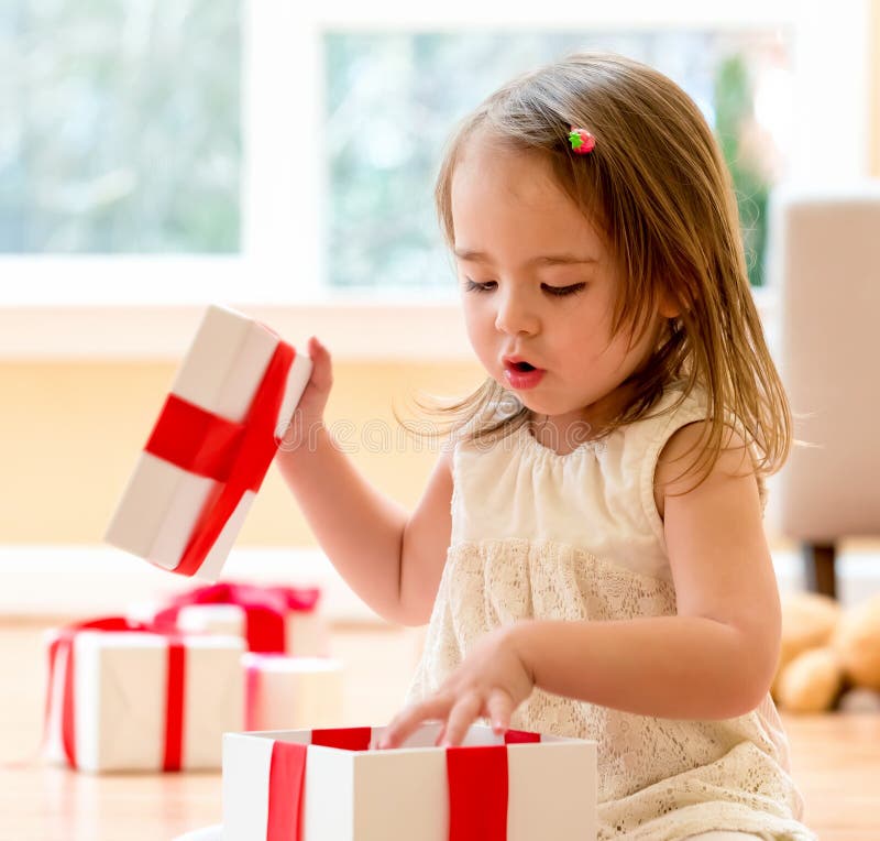 Girl Opening a Gift Box stock image. Image of multi, happiness - 26979601