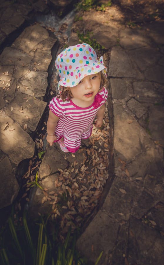 Little Girl on a Park Pathway Stock Photo - Image of dress, alone: 46936090