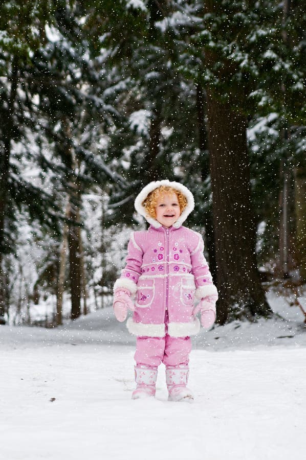 Little Girl in Pink Out in the Snow Stock Photo - Image of snow, forest ...