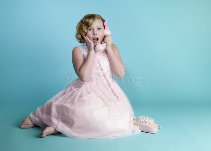 Little Girl on Pink Phone stock image. Image of feet - 19007933