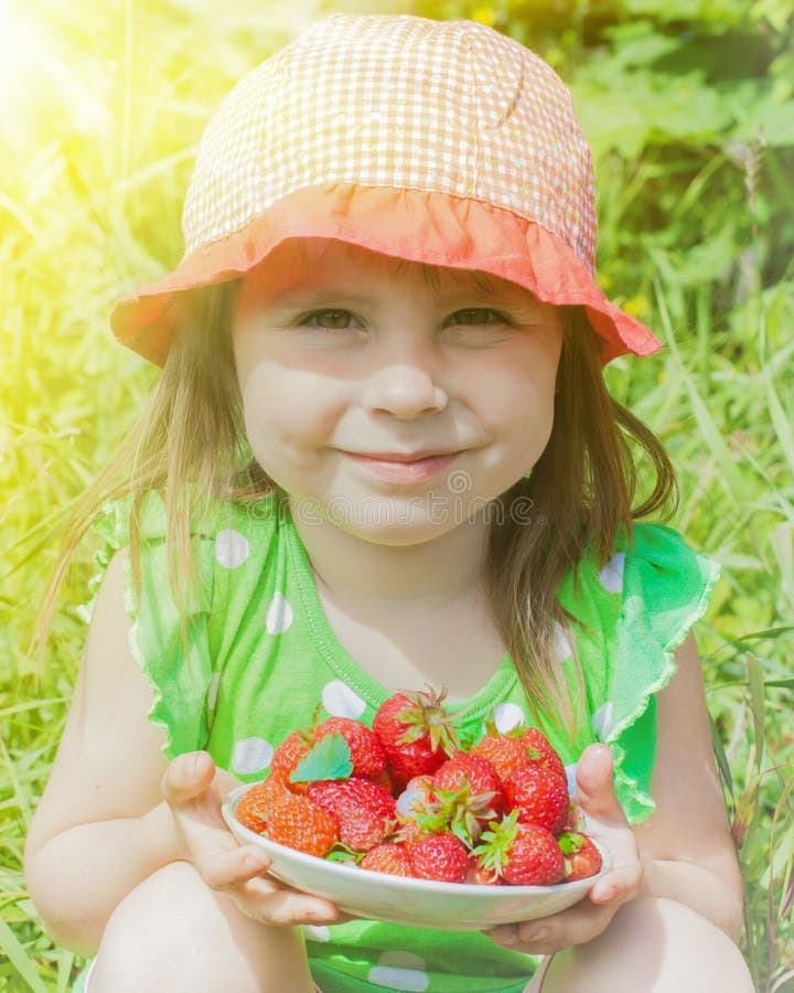 Little Girl with a Plate of Strawberries Stock Image - Image of ...