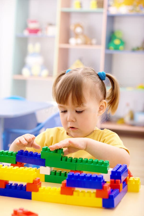 Little Girl Play with Building Bricks in Preschool Stock Photo - Image ...