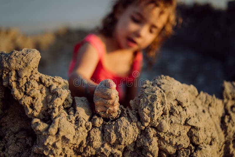 Little Girl Playing on the Beach, Digging Hole in Sand. Stock Image ...