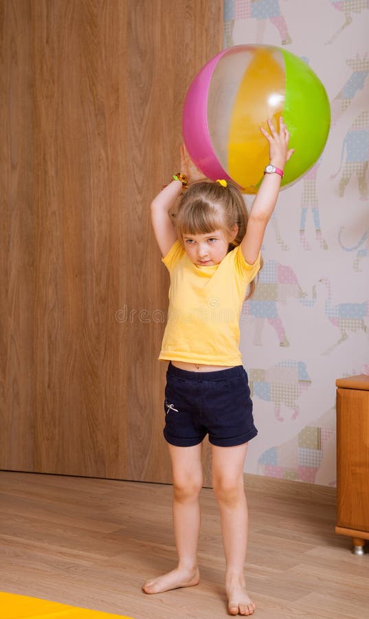 Little Girl Playing with a Big Ball Stock Photo - Image of caucasian ...