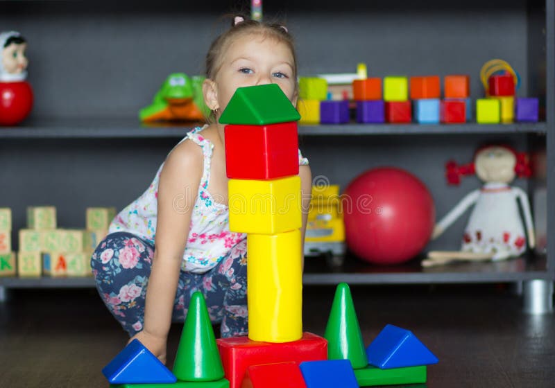 Little Girl Playing with Big Multicolor Plastic Blocks Stock Photo ...