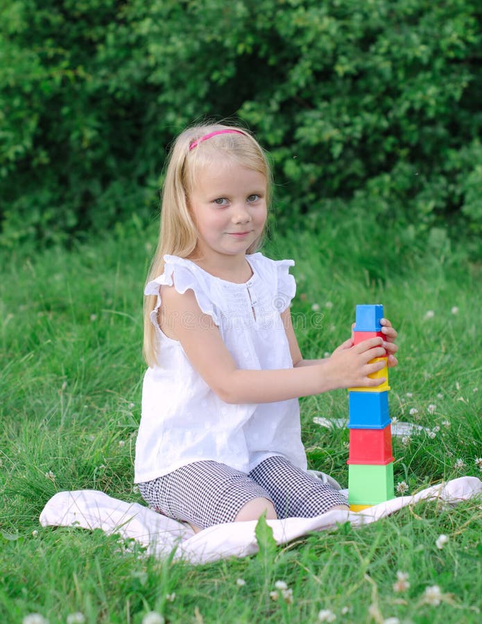 Little girl playing blocks stock image. Image of play - 32040819
