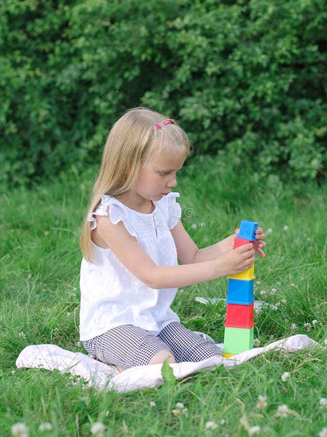 Little girl playing blocks stock photo. Image of learn - 32040844
