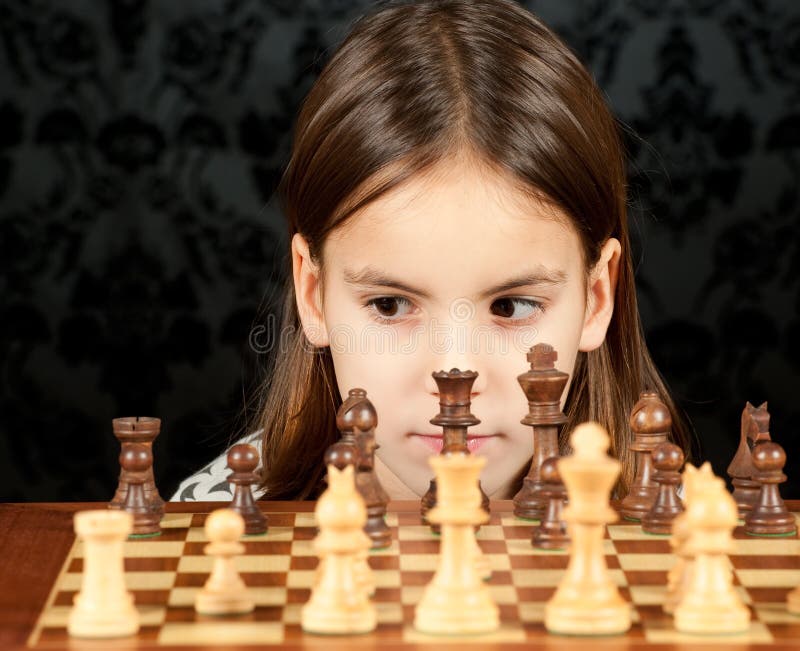 Little girl playing chess stock image. Image of concentrated - 22927463
