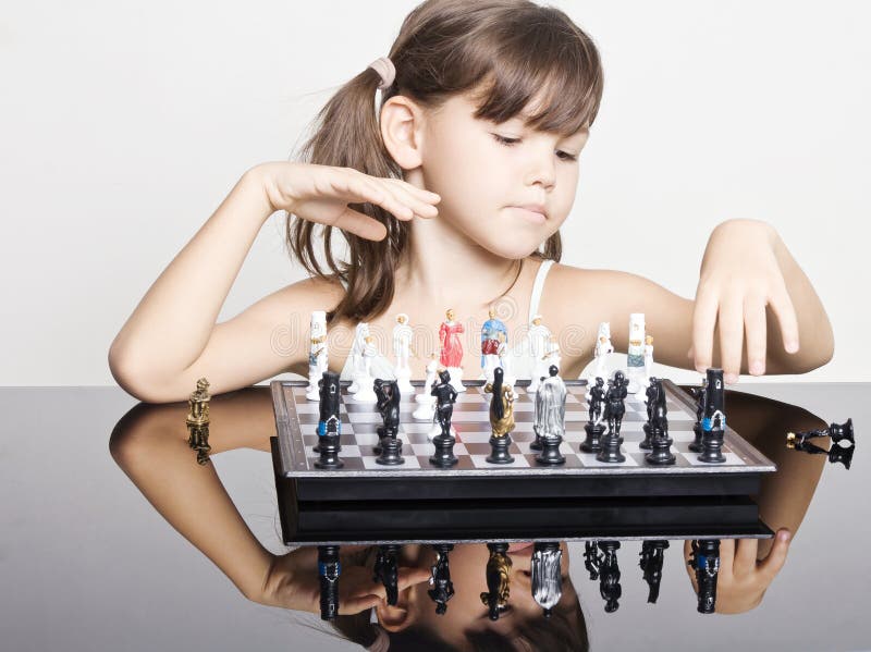 Little girl playing chess stock photo. Image of caucasian - 66355266