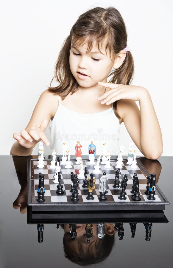 Little girl playing chess stock photo. Image of challenge - 66355754
