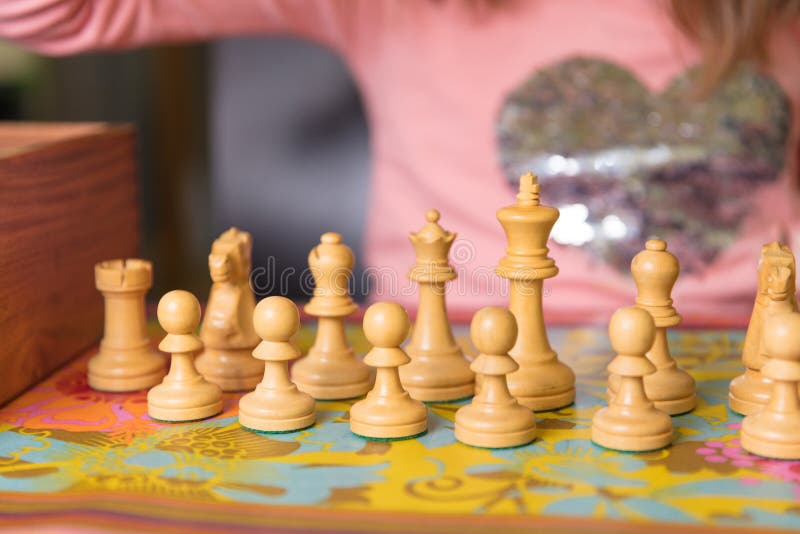 Little girl playing chess stock image. Image of playing - 245489515