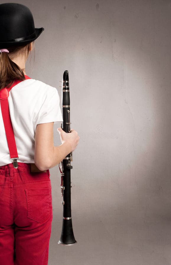 Little Girl Playing Clarinet Stock Image - Image of music, portrait ...