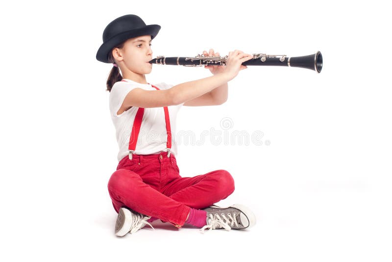Little Girl Playing Clarinet Stock Photo - Image of portrait, cute ...
