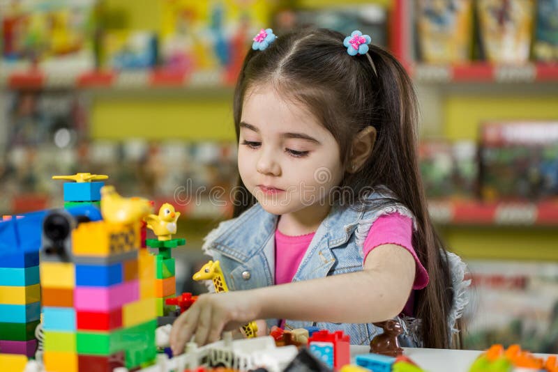 Little Girl Playing with Construction Blocks. Stock Image - Image of ...
