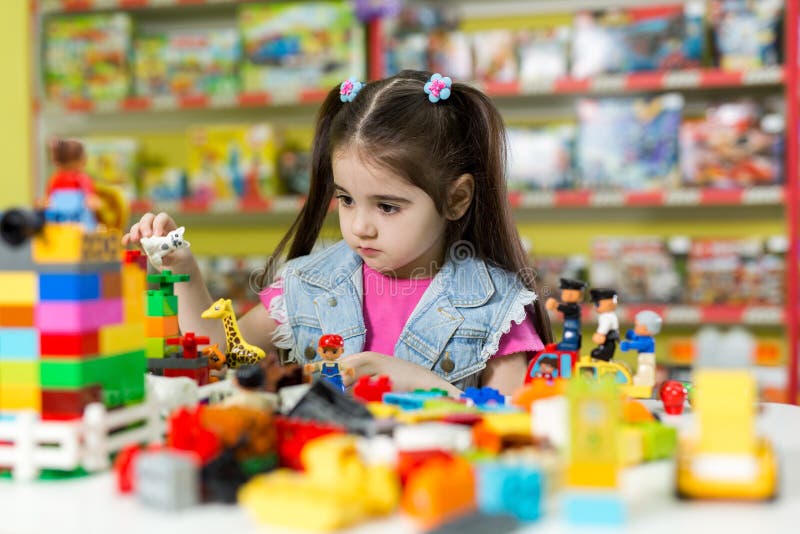 Little Girl Playing with Construction Blocks. Stock Photo - Image of ...
