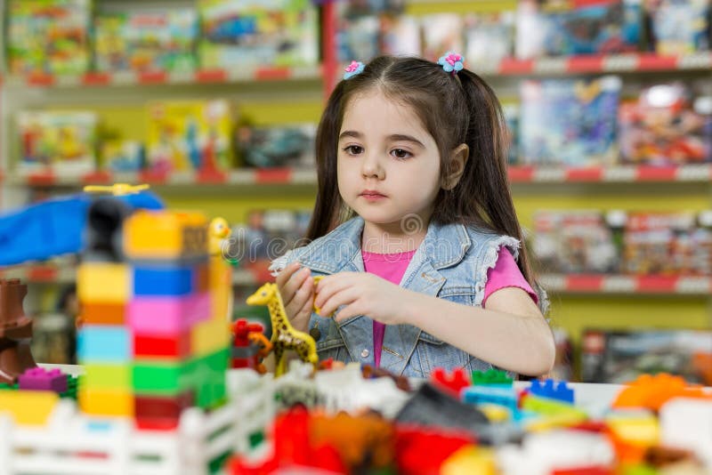 Little Girl Playing with Construction Blocks. Stock Image - Image of ...