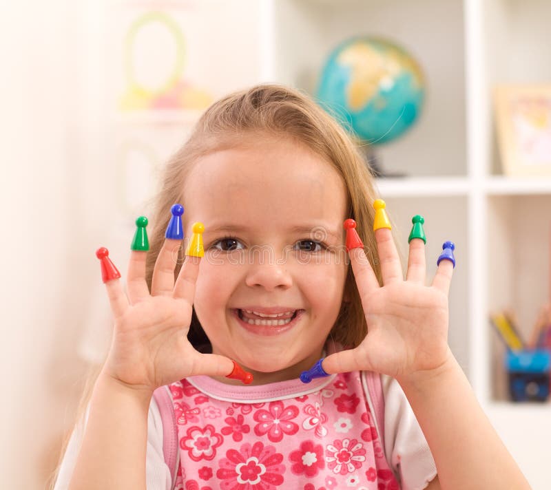 Little Girl Playing with Game Pieces Stock Image - Image of grin ...