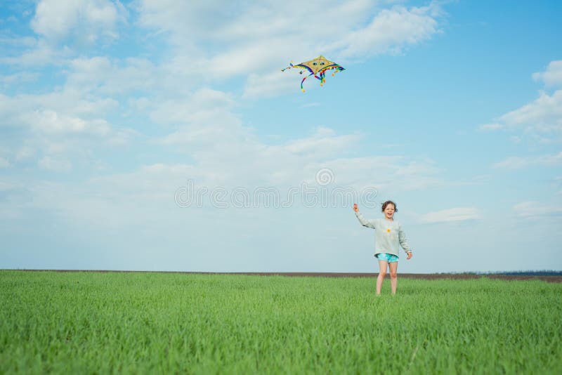 Little Girl Playing with a Kite on a Green Field Stock Image - Image of ...