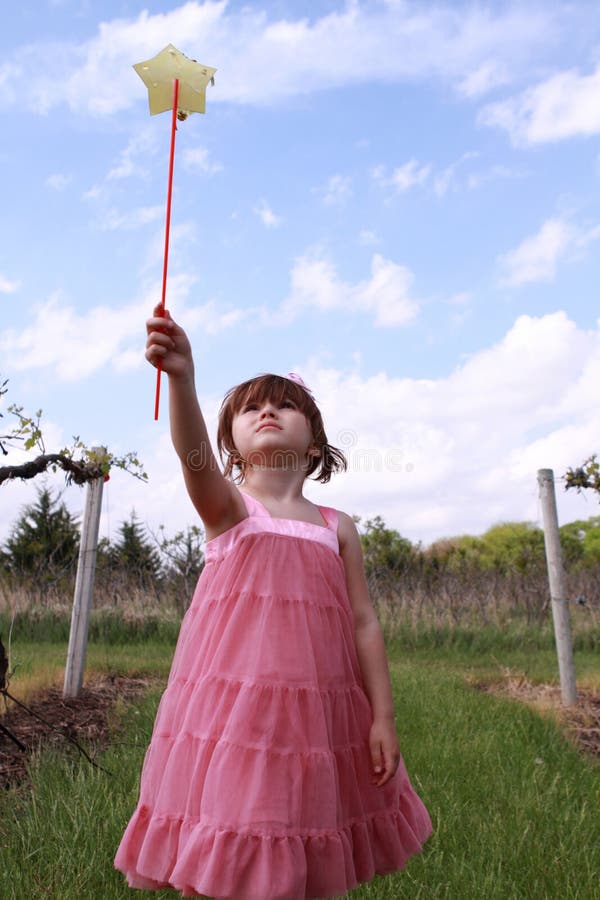 Little Girl Playing with Magic Wand Stock Photo - Image of childhood ...