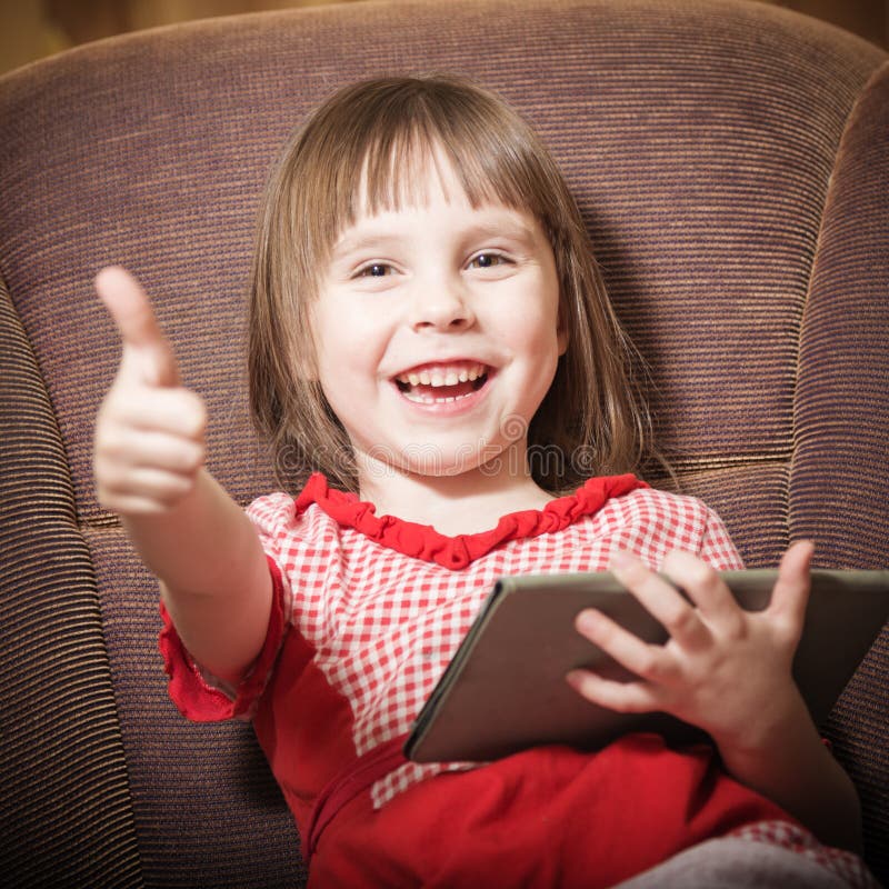 Little Girl Playing with a Modern Digital Tablet Stock Photo - Image of ...