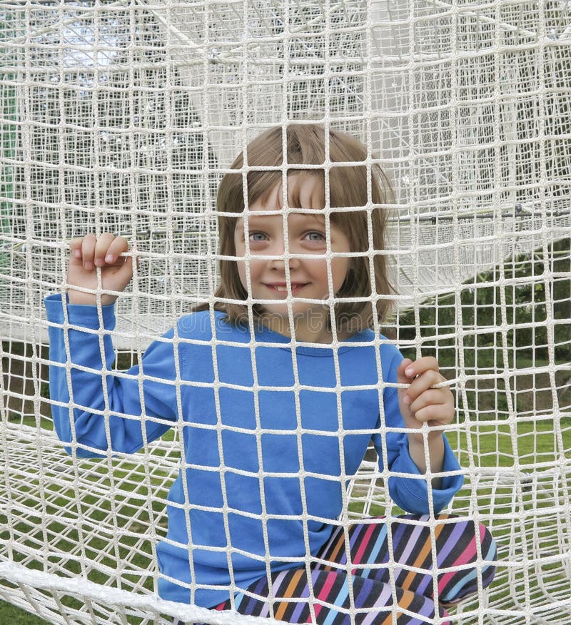 Little Girl Playing in a Net Stock Image - Image of safety, healthy ...