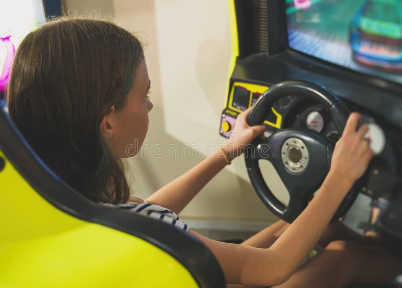 Little Girl Playing Racing Simulator Game. Stock Image - Image of ...