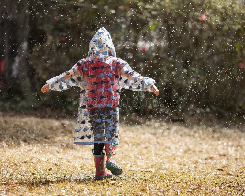 Little Girl Playing in the Rain Stock Photo - Image of person, spring ...