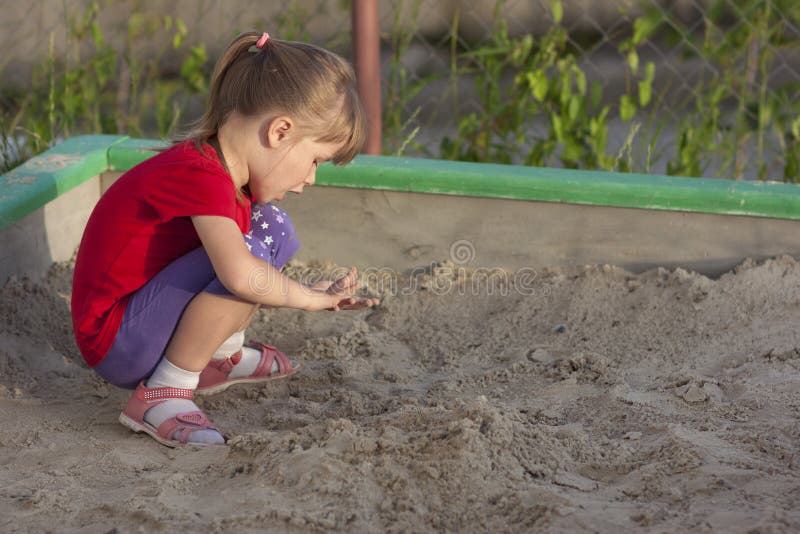 Little Girl Playing in Sandbox on a Sunny Summer Day Stock Image ...