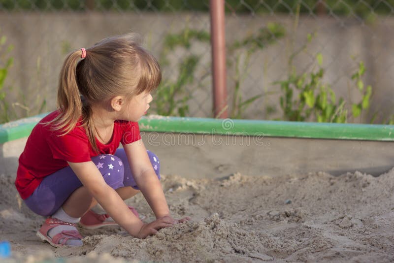 Little Girl Playing in Sandbox on a Sunny Summer Day Stock Image ...