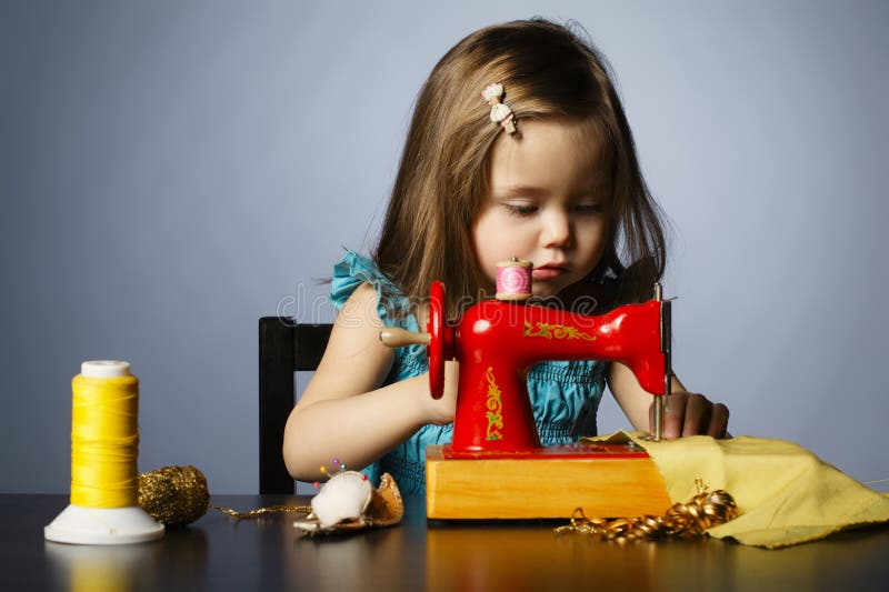Little Girl is Playing with Sewing Machine Stock Image - Image of ...