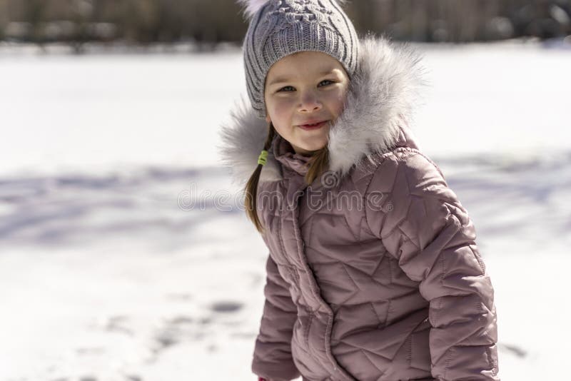 Little Girl Playing in the Snow. Snowy Winters Stock Photo - Image of ...