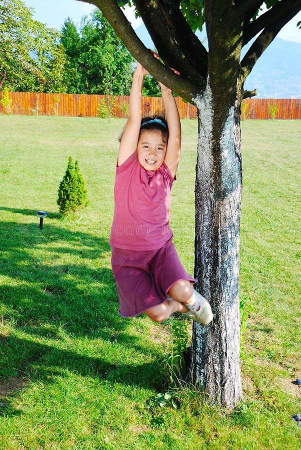 Little Girl is Playing on Tree Stock Image - Image of ability, foliage ...