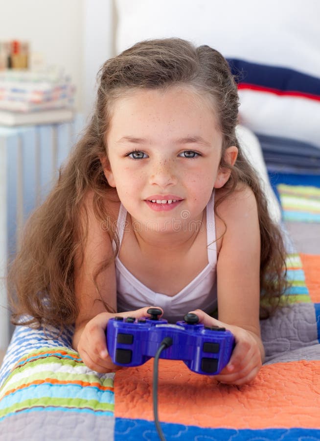 Little Girl Playing Video Games Stock Image - Image of portrait, small ...