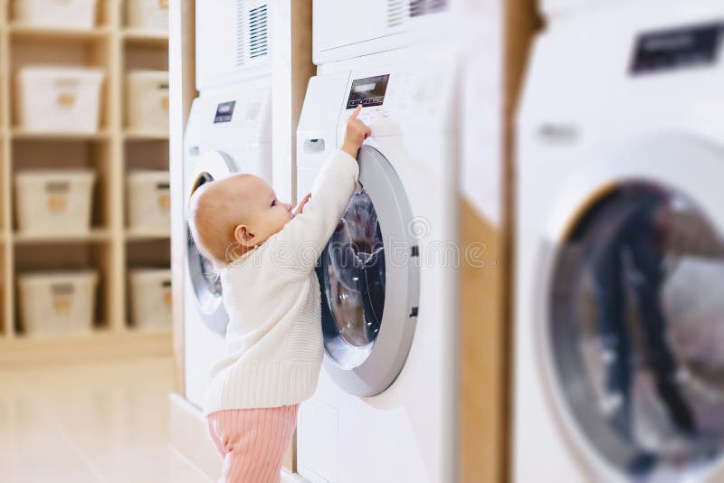 The Girl is Playing with a Washing Machine Stock Image - Image of happy ...