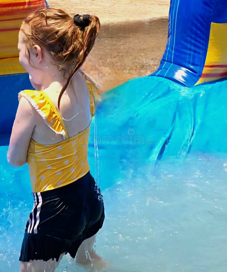 Little Girl Playing in the Water on a Hot Day.. Stock Photo - Image of ...