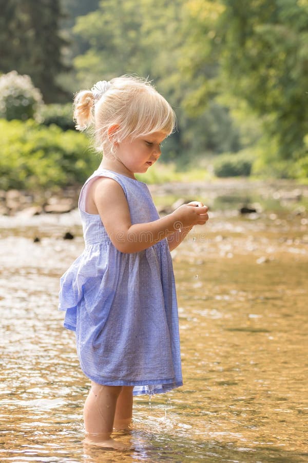 Little Girl is Playing with Water Stock Photo - Image of baby ...