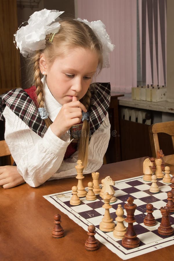 Little girl plays chess stock photo. Image of child, game - 19961740