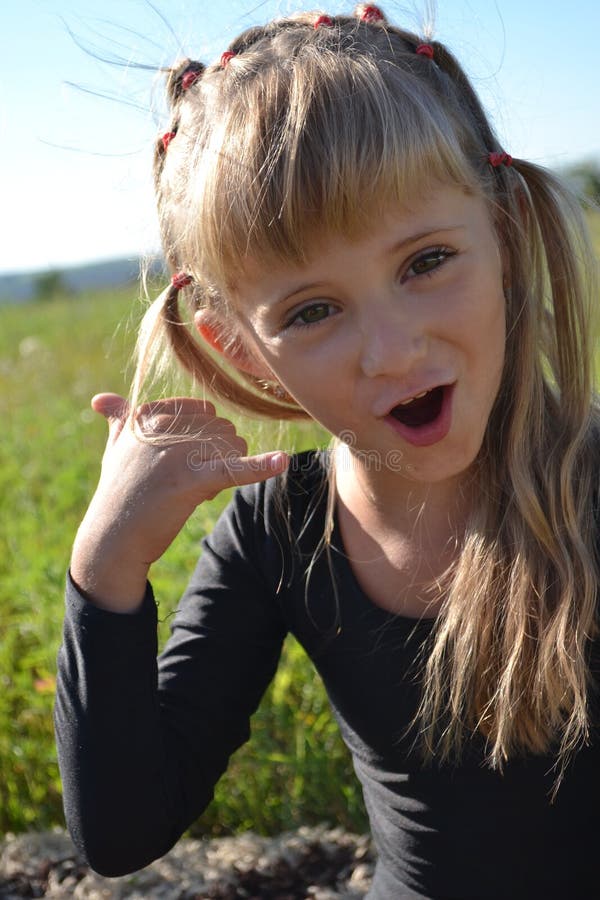 Little Girl Plays Imaginary Phone Stock Photos - Free & Royalty-Free ...