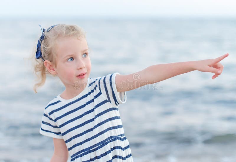 Little Girl Points Direction Stock Image - Image of seashore, innocent ...