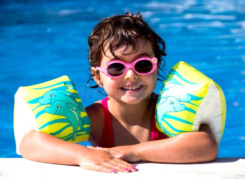 Little girl in a pool stock photo. Image of childhood - 32714664