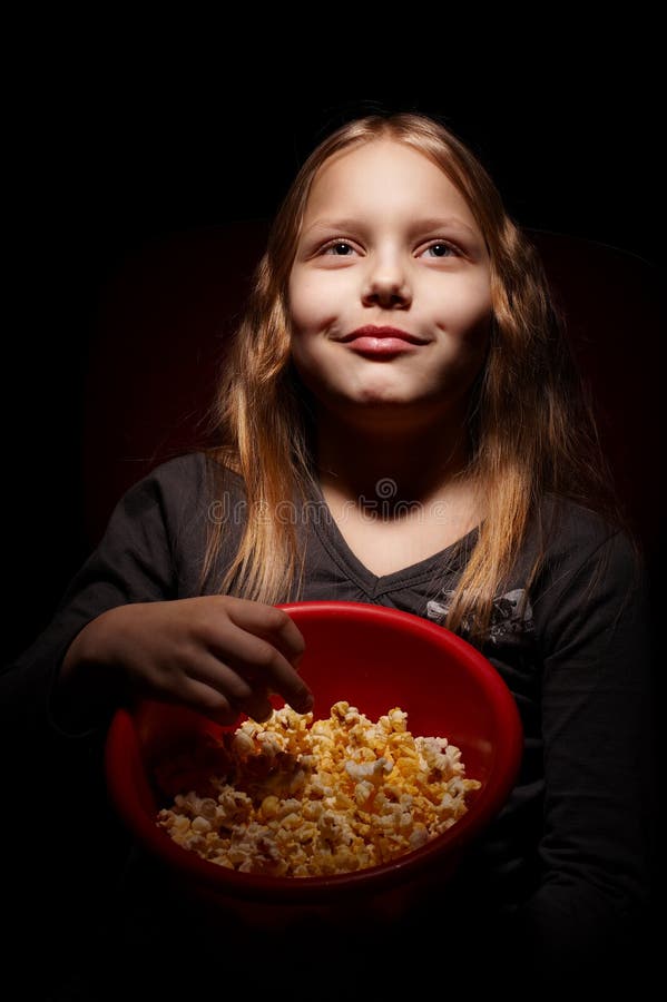 Little girl with popcorn stock image. Image of beauty - 12959541