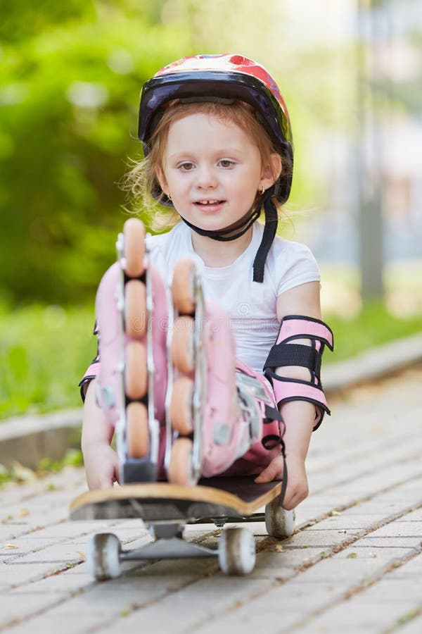 Little Girl in Protective Equipment and Rollers Stock Photo - Image of ...