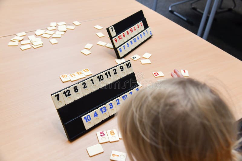 A Little Girl Puts the Chips with Numbers in Order Stock Image - Image ...