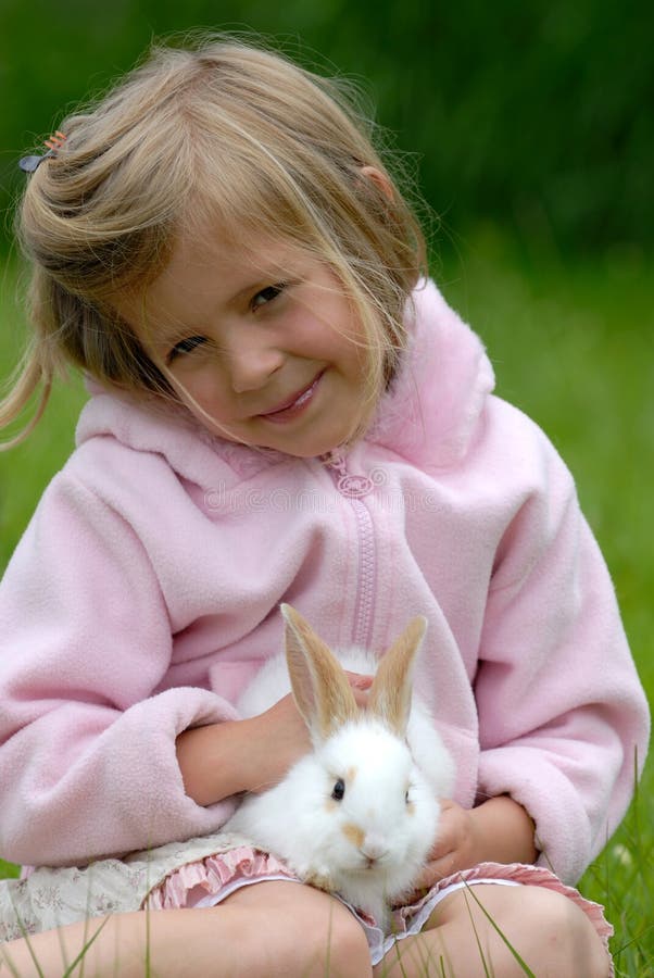 Little girl with a rabbit stock image. Image of cute, muzzle - 1768617