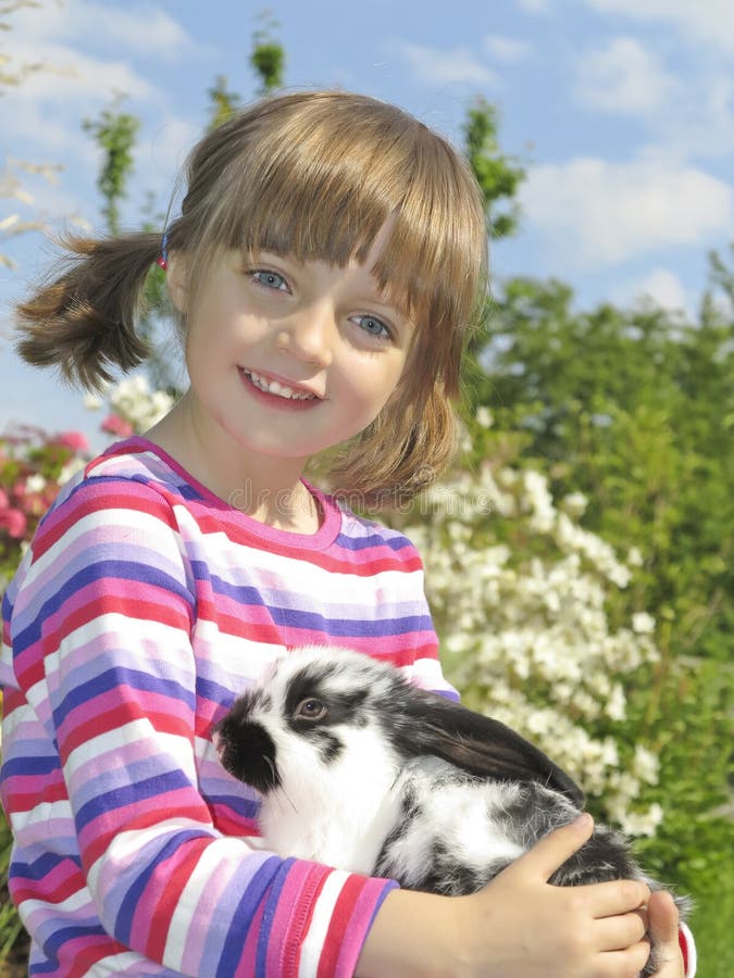 Girl with rabbit stock image. Image of charming, bunny - 16120729