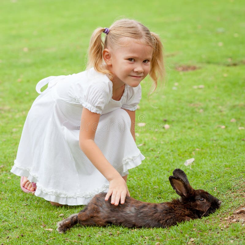Little girl with rabbit stock photo. Image of happy, outdoor - 41886916