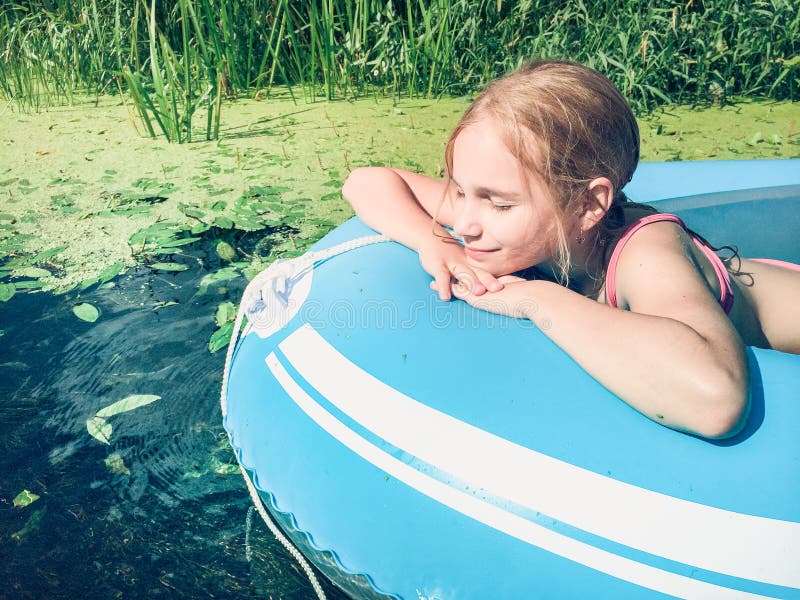 Little girl in a raft stock photo. Image of child, summer - 45215360