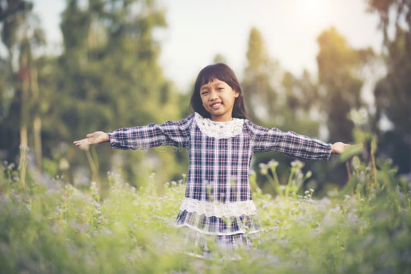Little Girl Raising Hand Refresh Stock Photo - Image of asia, beautiful ...